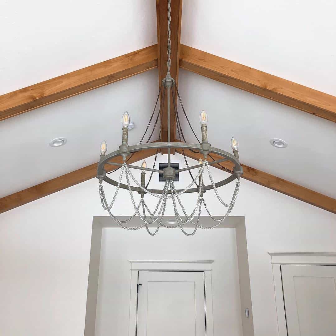 Vaulted Ceiling with Gray Wagon Wheel Chandelier - Soul & Lane