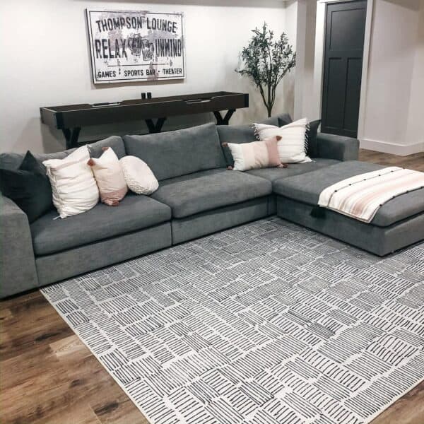 Modern Grey Couch with White and Black Rug - Soul & Lane