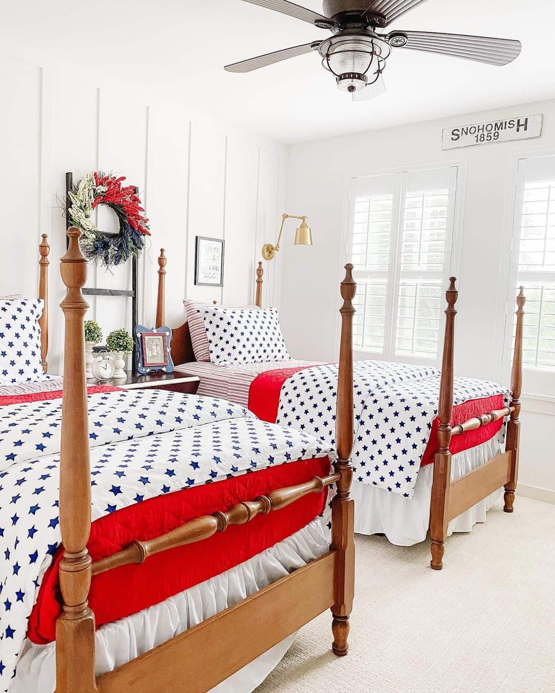 Bedroom with Two Wood Four Poster Beds - Soul & Lane