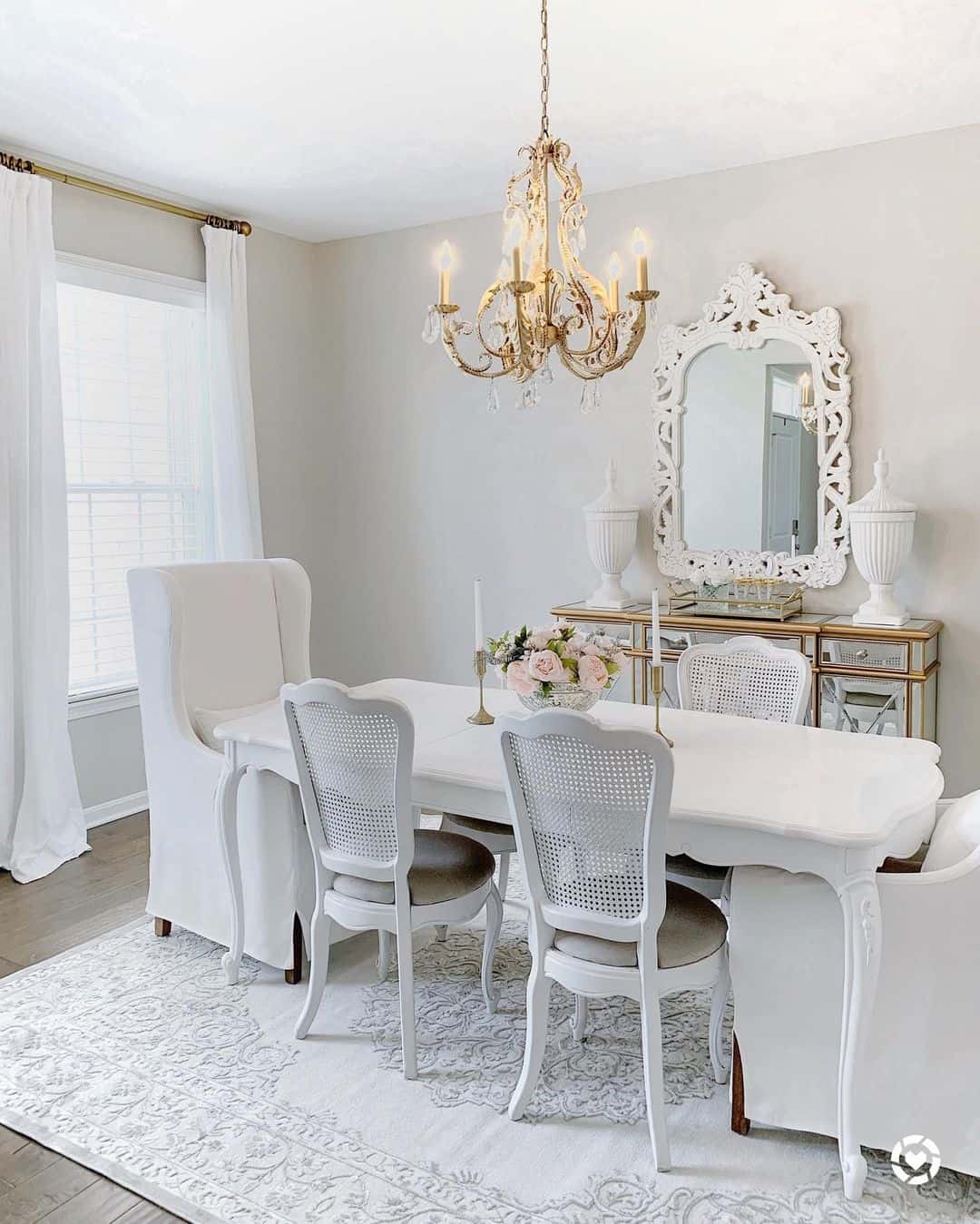 Gold Chandelier Over White Dining Table - Soul & Lane