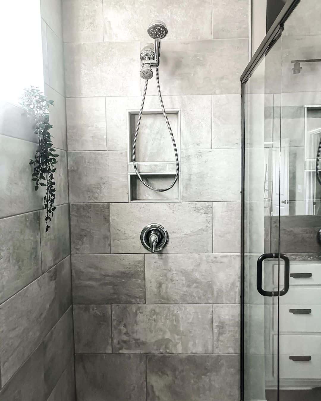 Plant Hanging Over Large Grey Bathroom Tiles - Soul & Lane