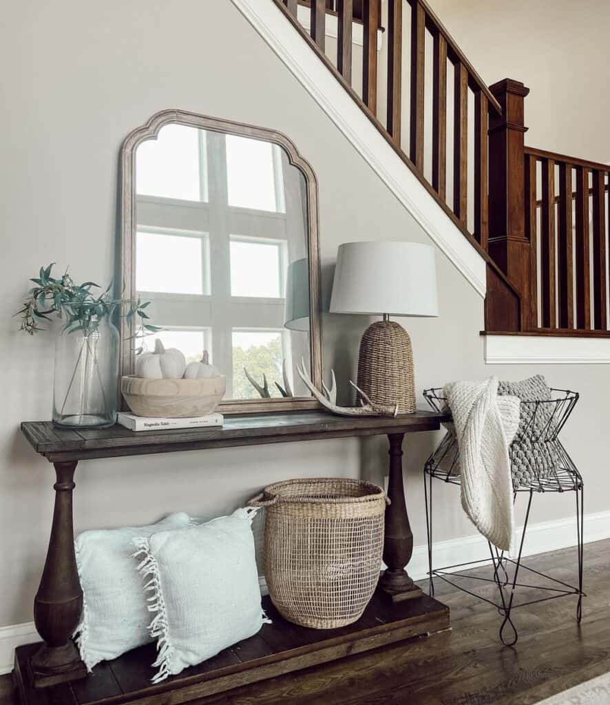 Stained Wood Staircase Railing Over Console Table - Soul & Lane