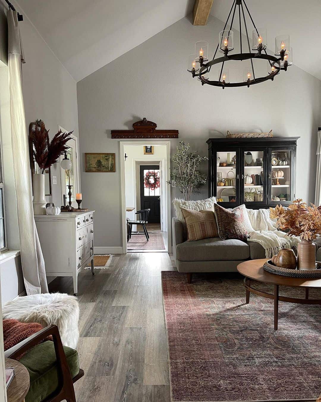 Vaulted Ceiling With Wood Beam and Round Black Chandelier - Soul & Lane