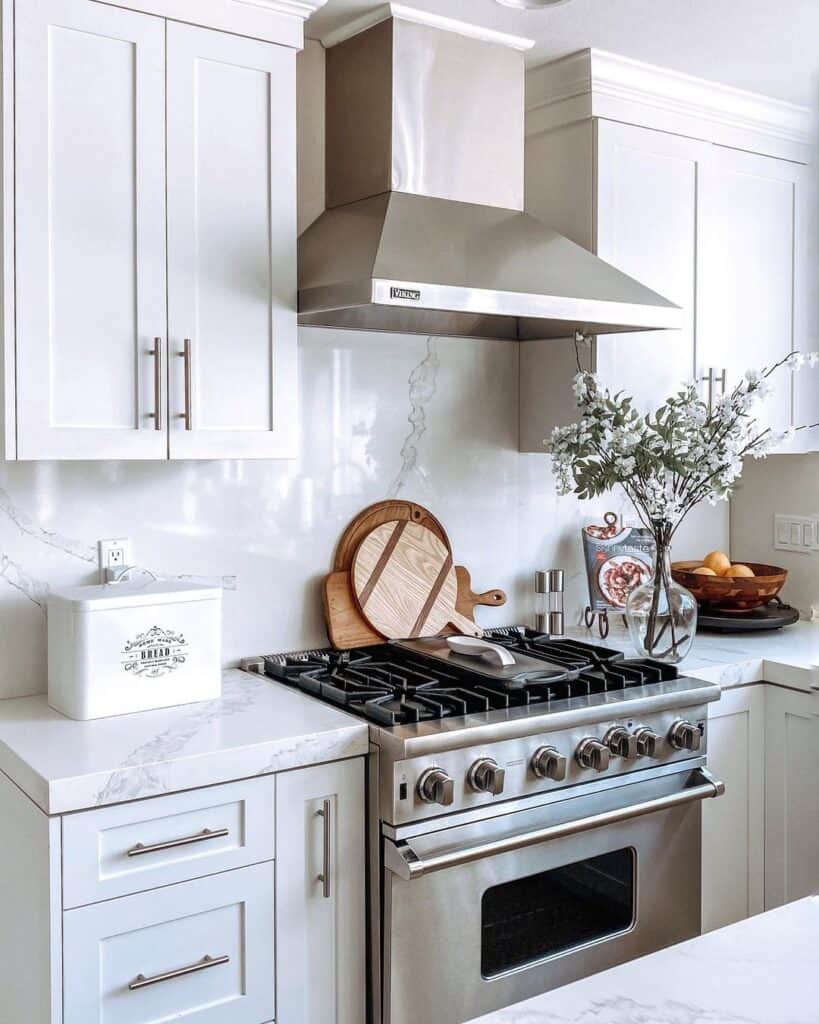 White Stone Backsplash Under Stainless Steel Hood - Soul & Lane