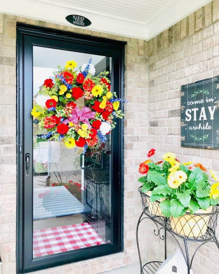 Brick Home with Spring Wreath Decor - Soul & Lane