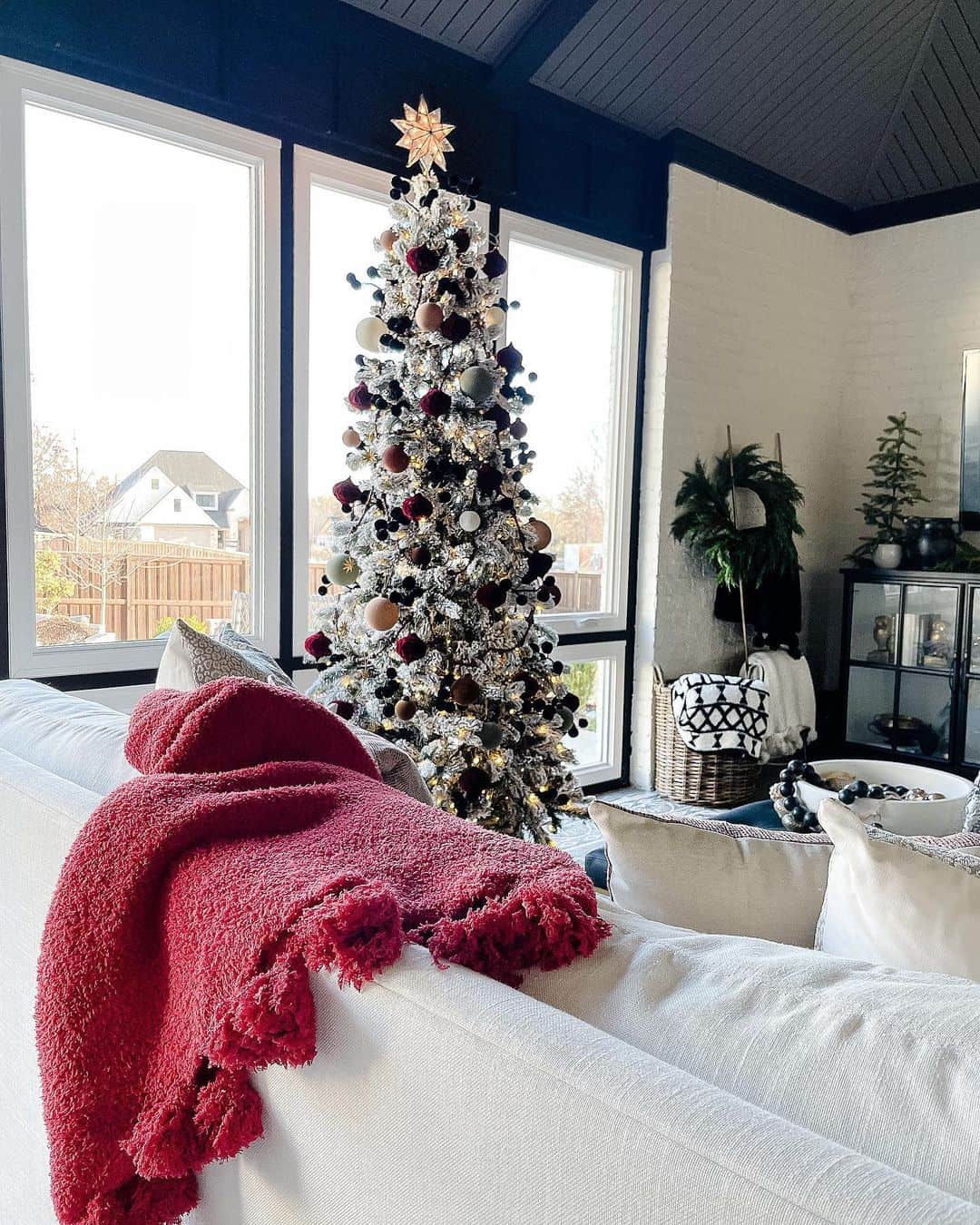 Modern Living Room with Blue Vaulted Ceiling and Flocked Tree - Soul & Lane