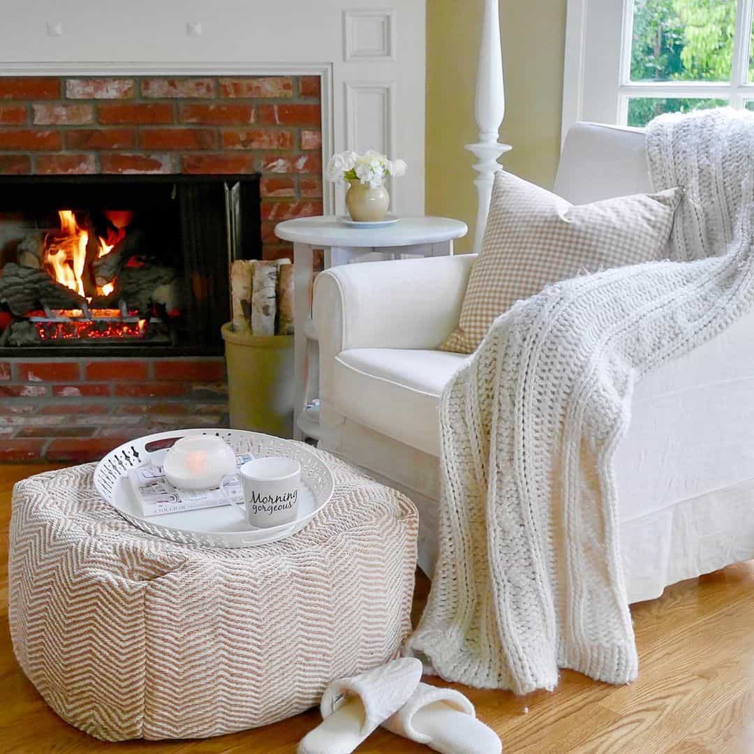 Off-White Living Room Pouf Next to Slippers - Soul & Lane