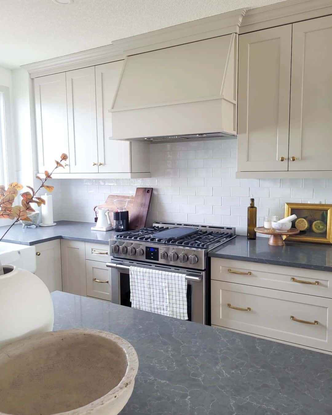 White Crown Molding Above a Dark Grey Counter - Soul & Lane