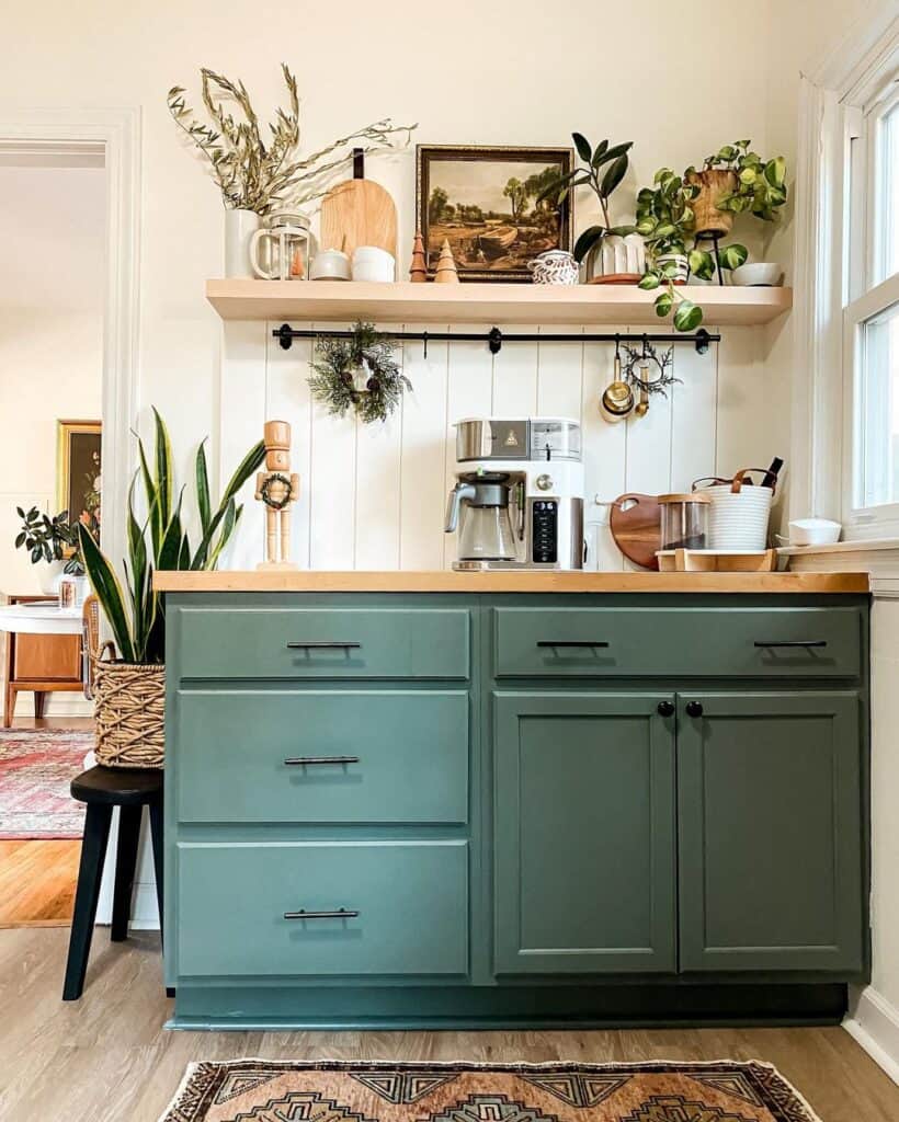 Wooden Nutcracker on Sage Green Kitchen Cabinets - Soul & Lane