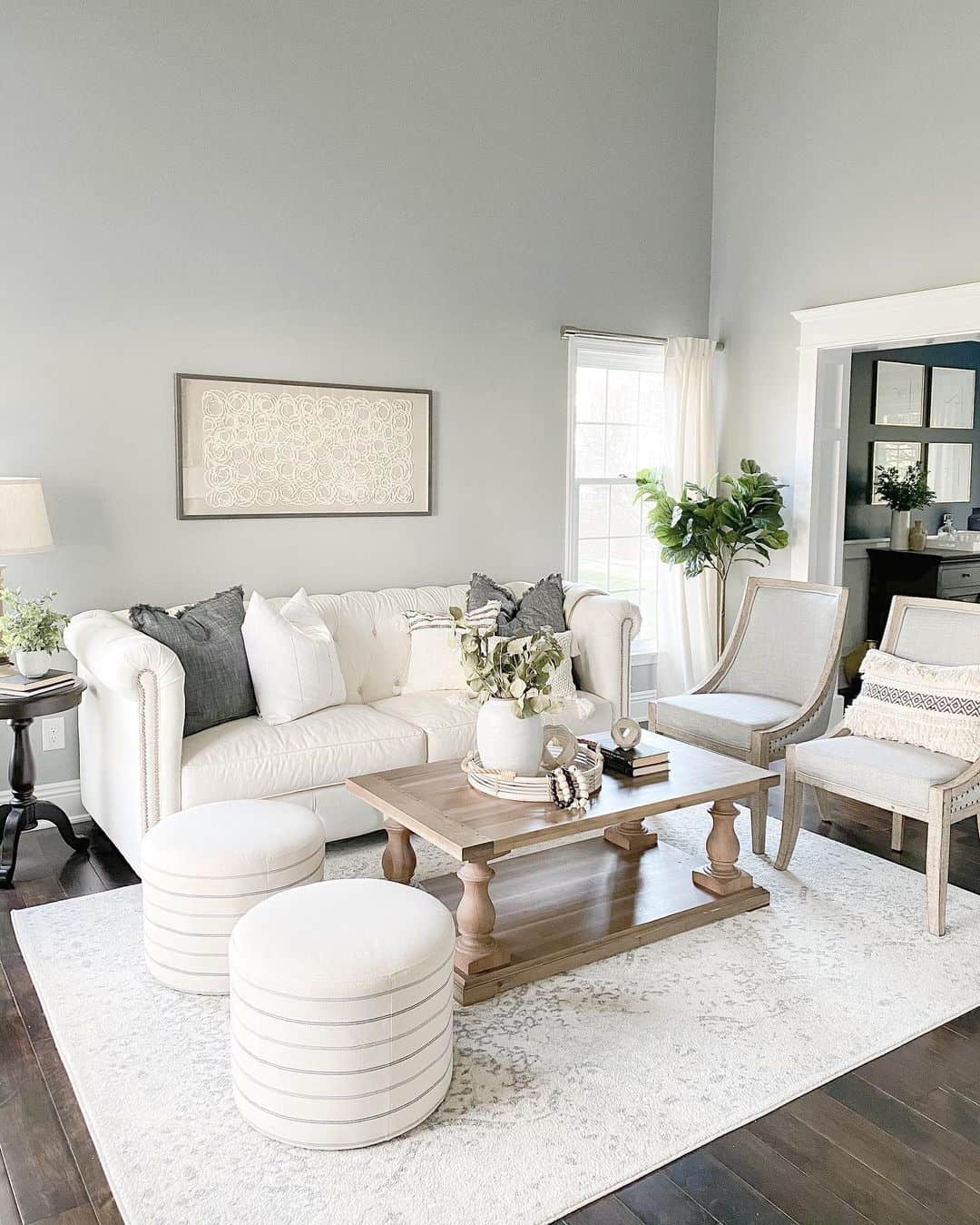 Chesterfield Sofa with Round White Poufs - Soul & Lane