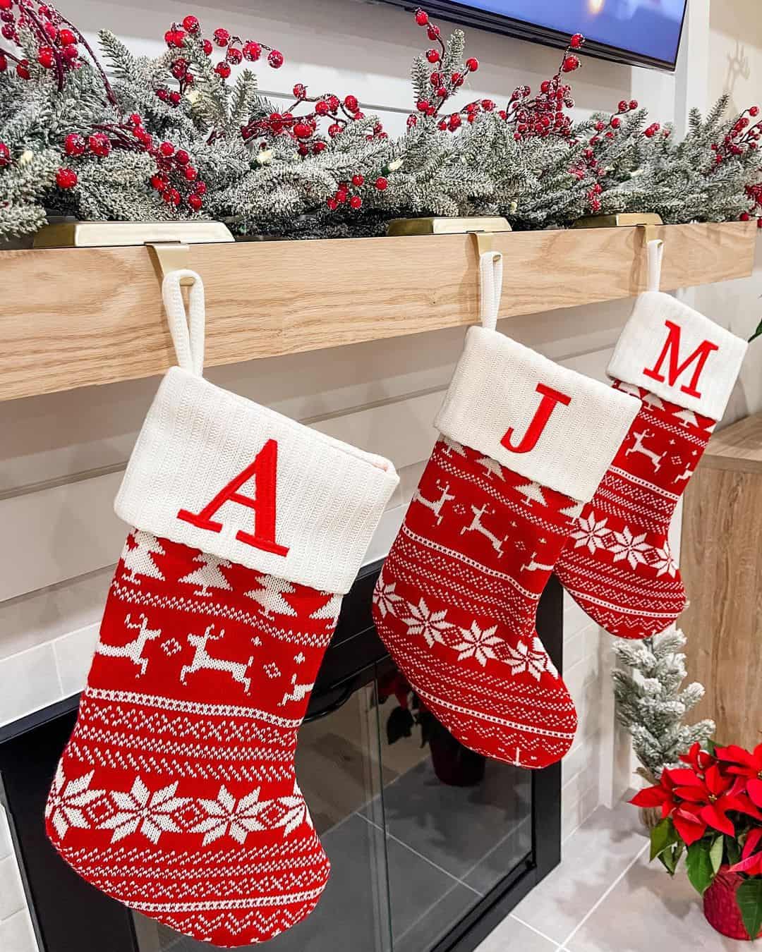 Red Stockings Hang From Gold Stocking Holders for the Fireplace - Soul ...