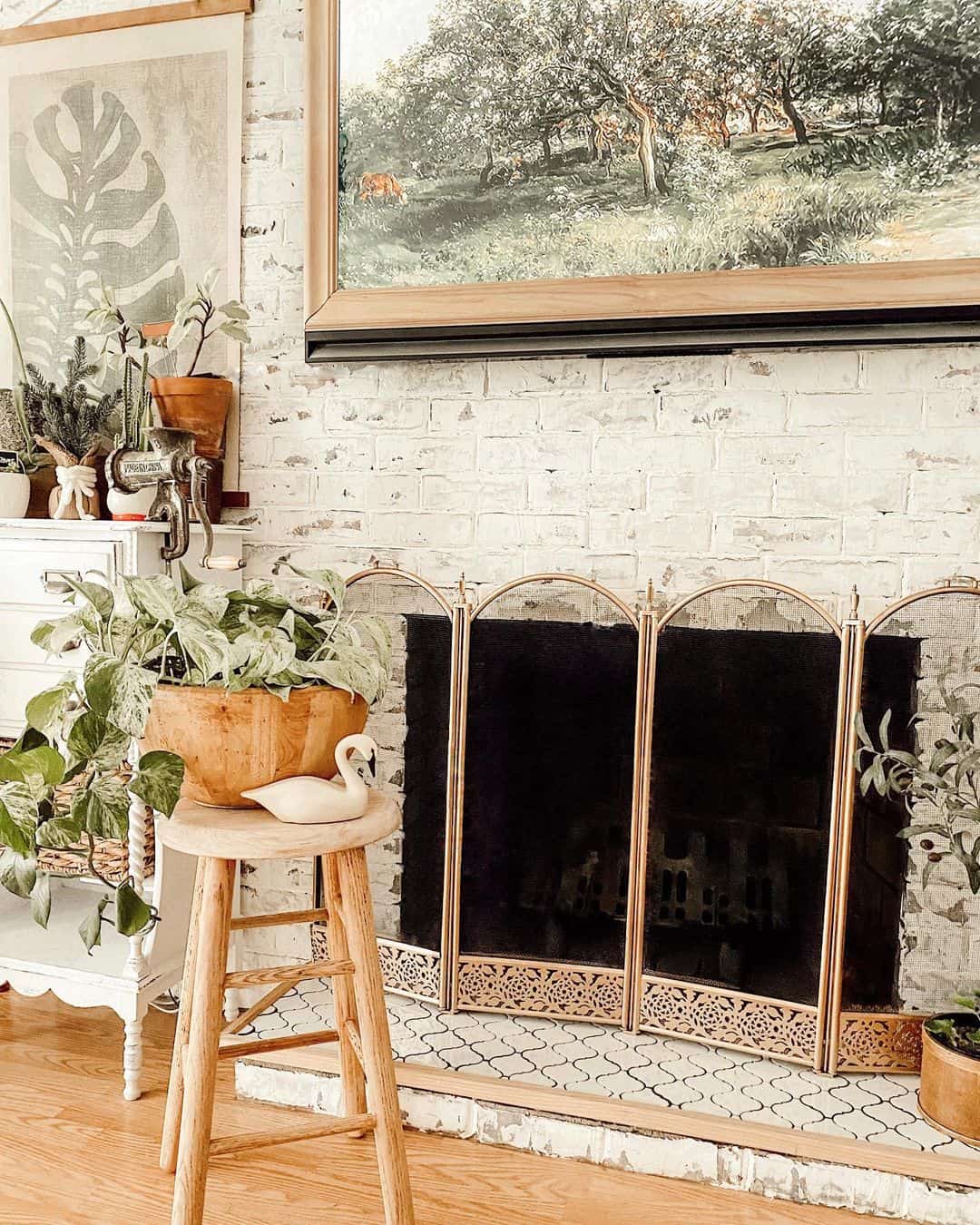 White Brick Fireplace with Gold Fireplace Gate - Soul & Lane