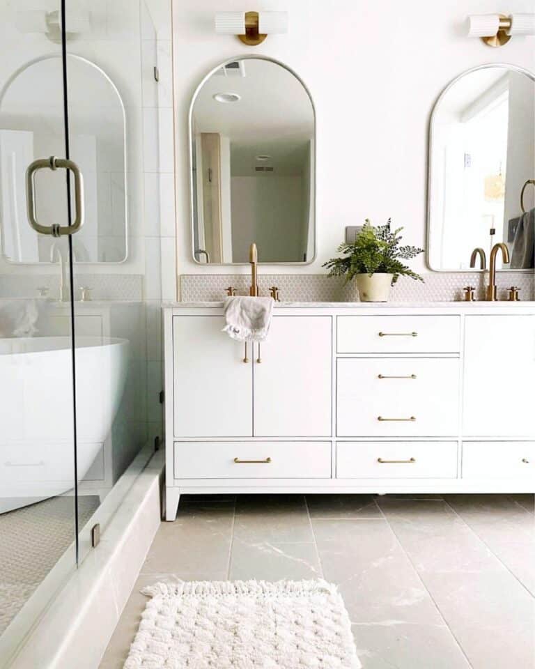 Angled Stone Shower Curb in Neutral Bathroom - Soul & Lane