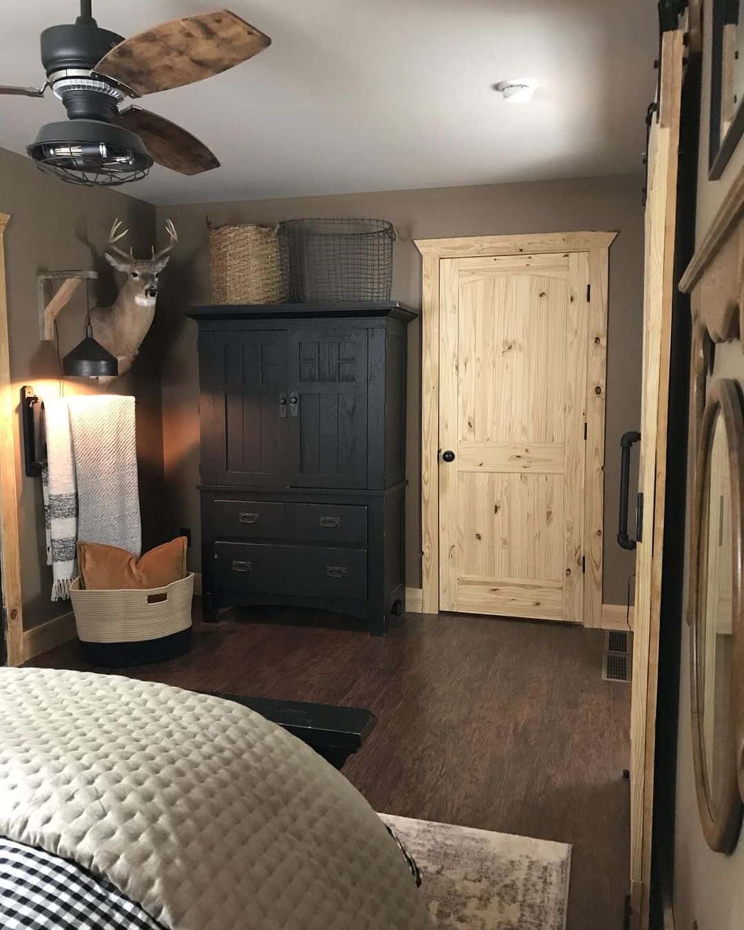Rustic Natural Wood Door in Dark-Toned Bedroom - Soul & Lane