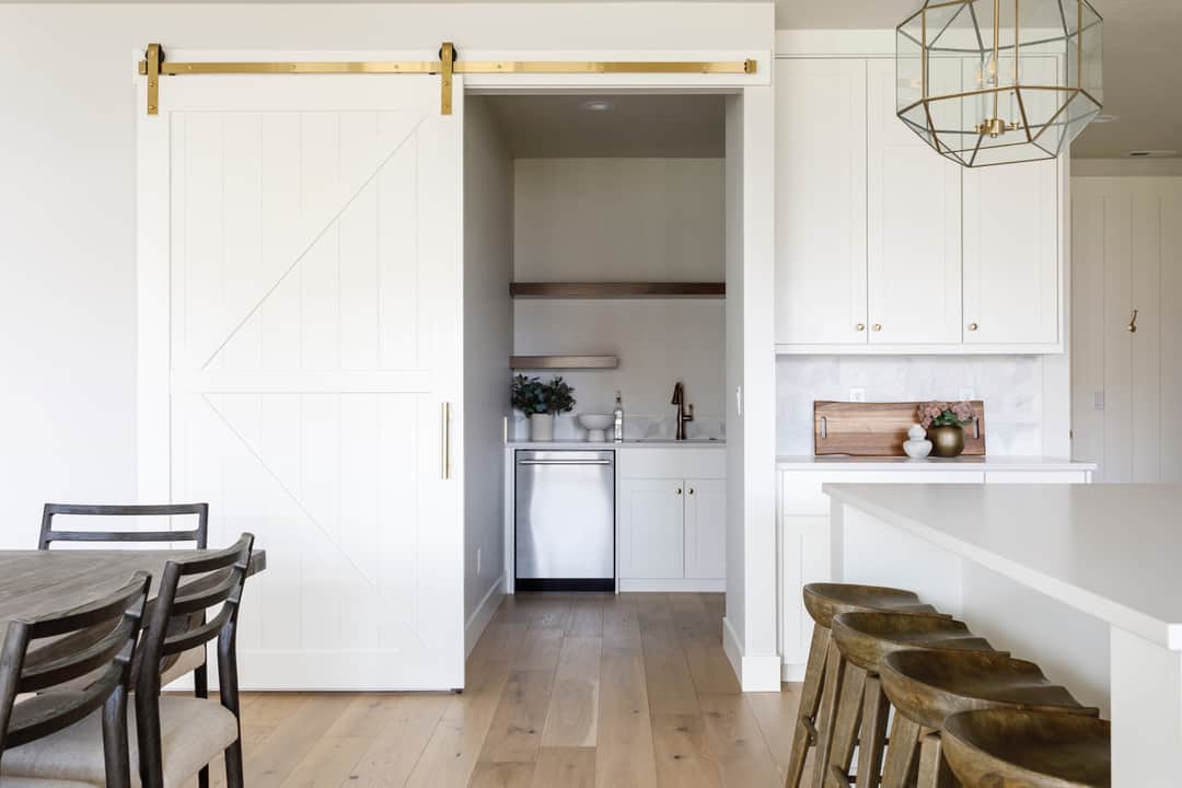 White Sliding Butler's Pantry Door on Gold Rail - Soul & Lane
