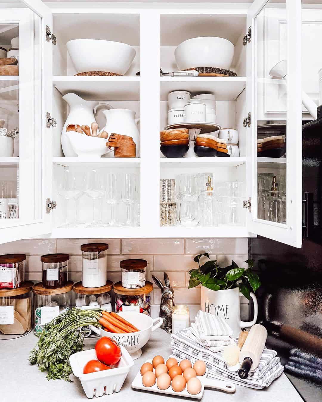 Open Glass Doors of a White Kitchen Cabinet - Soul & Lane