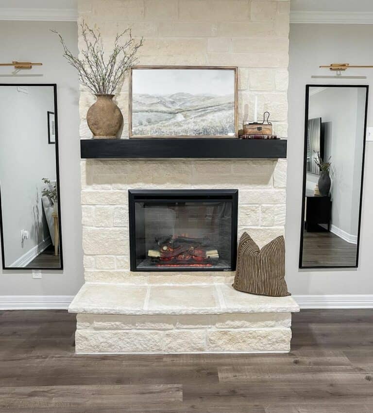 White-stone Fireplace With a Black Mantel - Soul & Lane