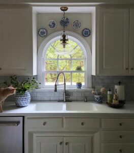 Decorative Ceramic Plates Over Arched Window - Soul & Lane