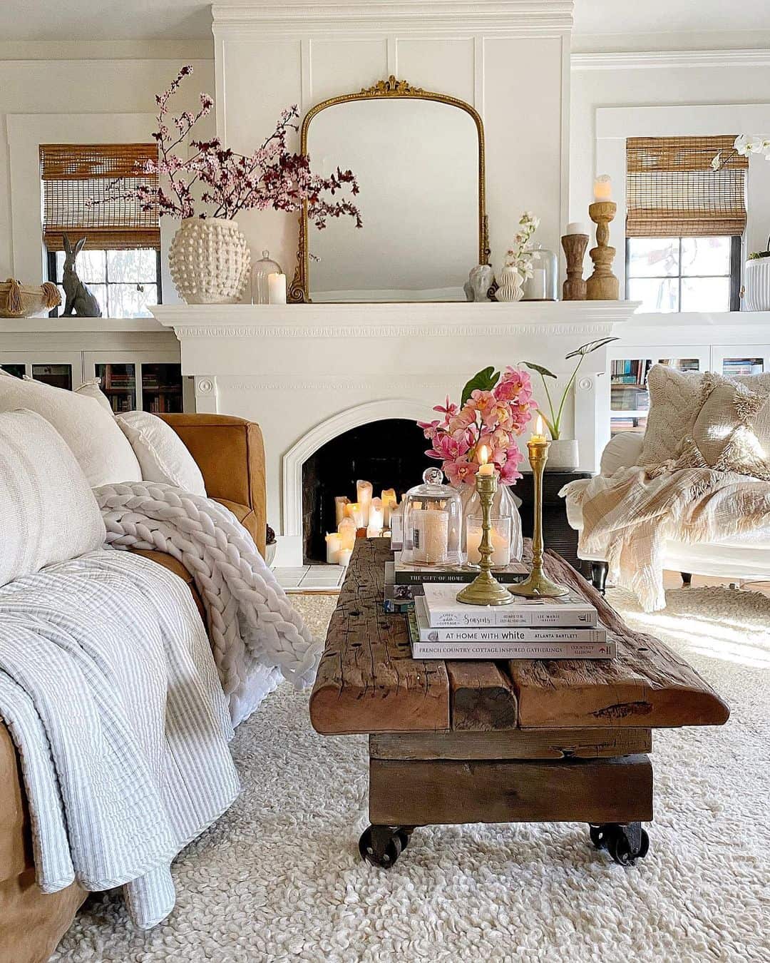 Delicate Pink Flowers, Gold Candlesticks, and White Candles - Soul & Lane