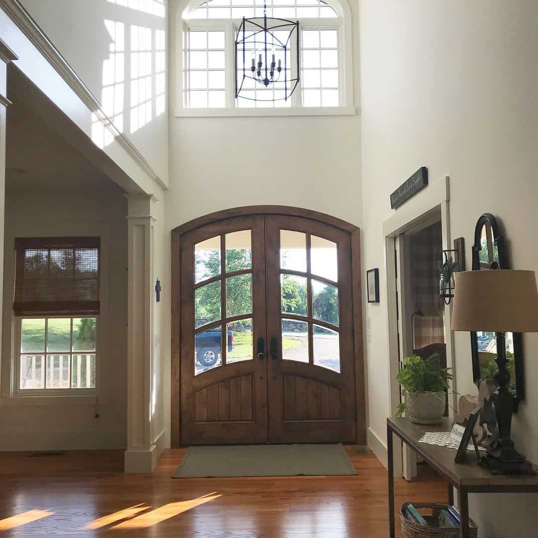 Farmhouse Foyer With Stained Wood Arched Doors - Soul & Lane