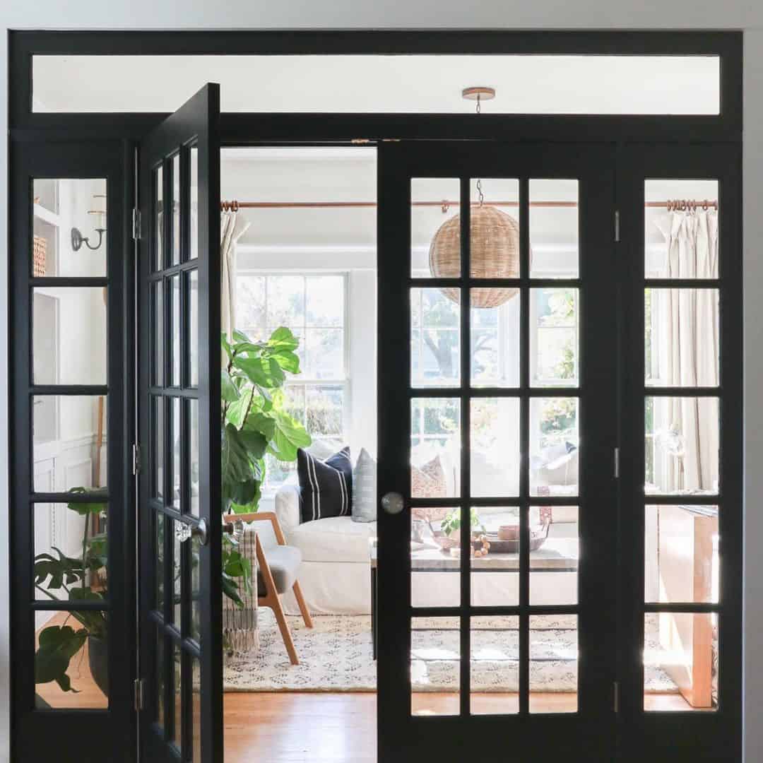 Farmhouse Living Room With Black Doors - Soul & Lane