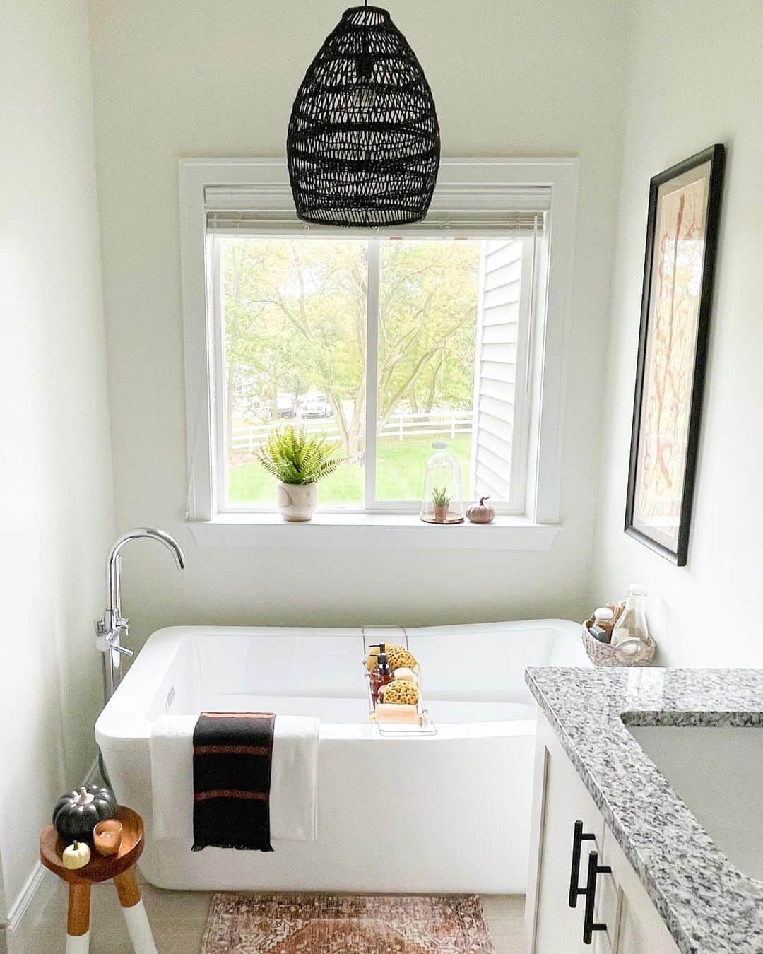 Freestanding Bathtub Positioned Beneath a Window - Soul & Lane