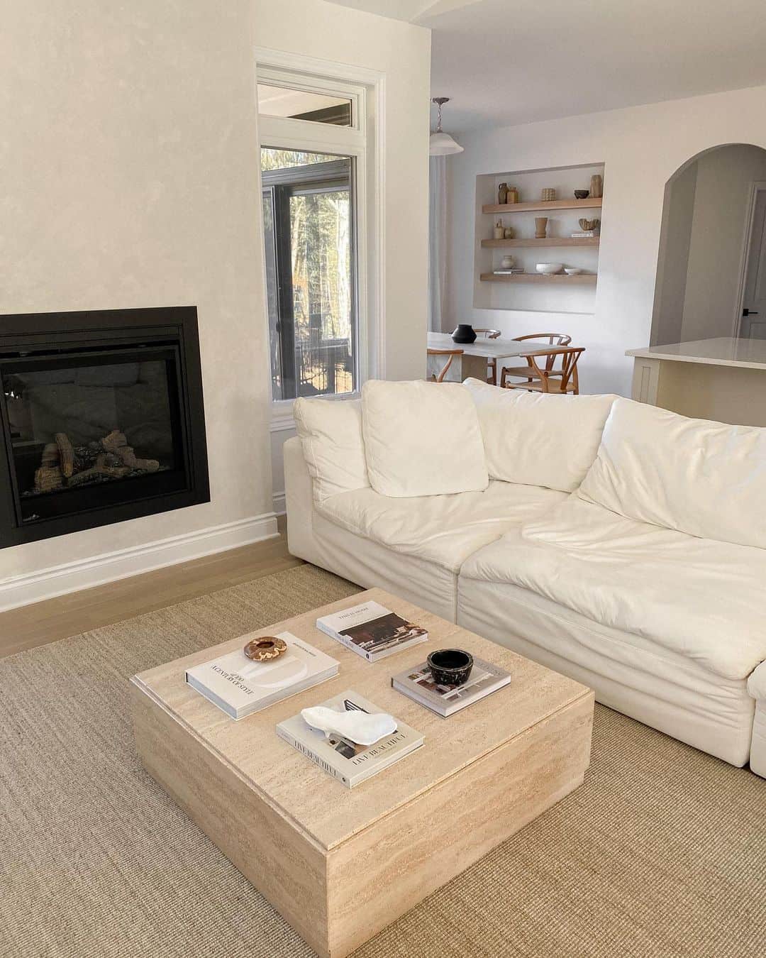 Minimalist Living Room With Textured Fireplace - Soul & Lane