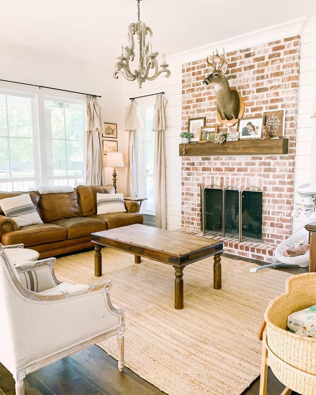 Brick Living Room Fireplace With Deer Head Décor - Soul & Lane