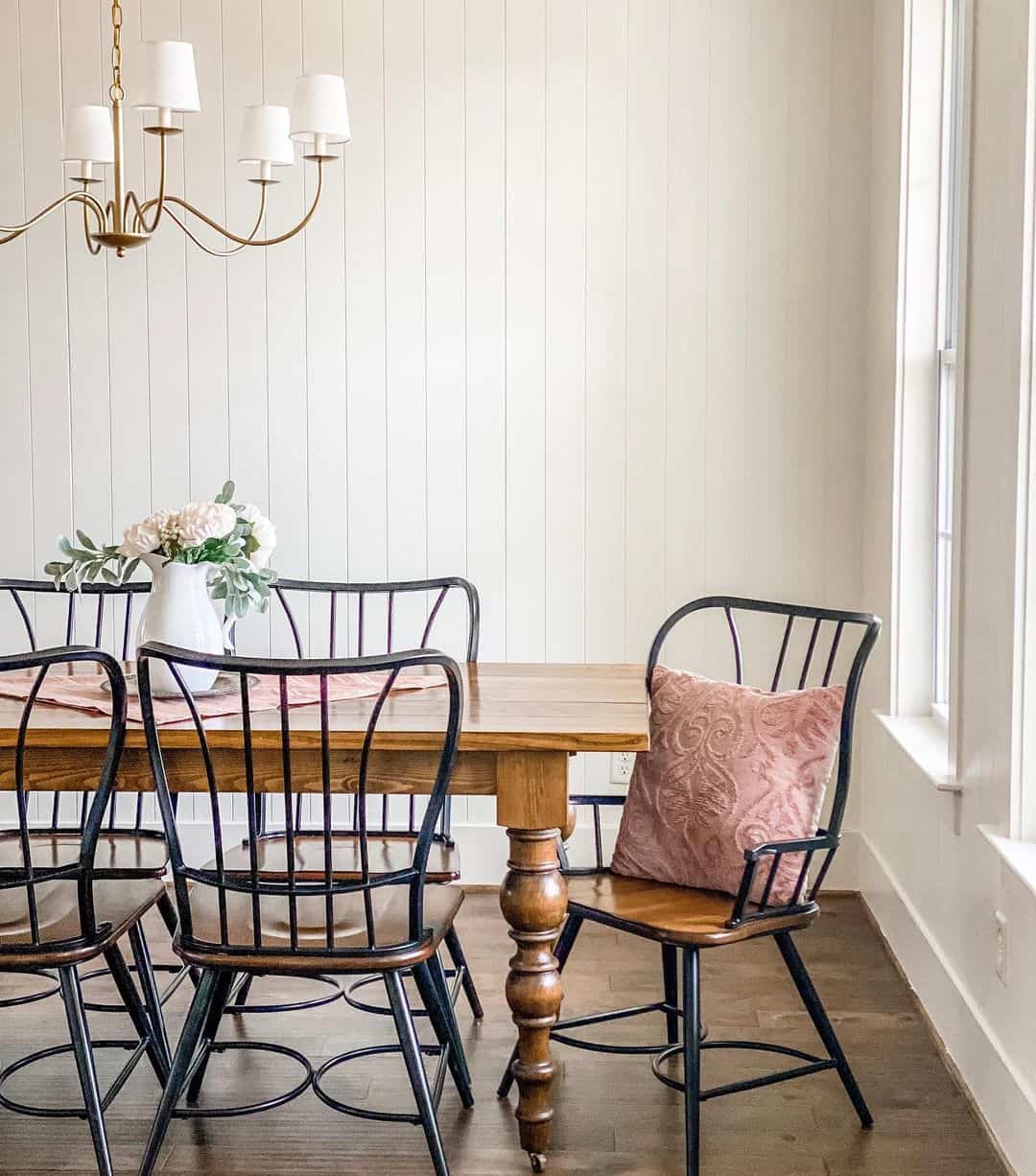 Vintage Chairs Border a Wooden Dining Table - Soul & Lane