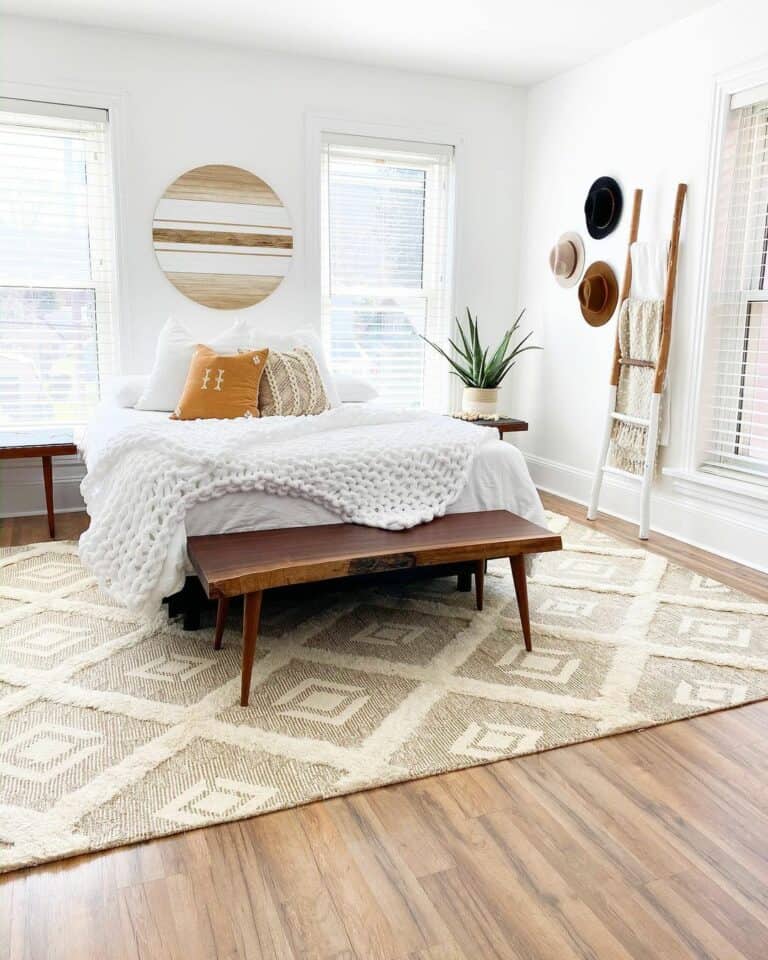 Warm Wood Bedroom Floors With a Large Neutral Area Rug - Soul & Lane
