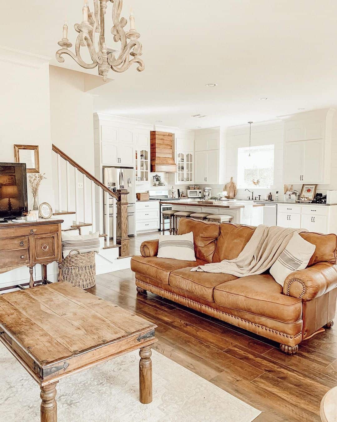 Open Concept Living Area With Brown Leather Sofa - Soul & Lane