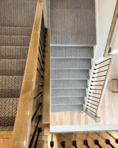 Stairwell With Beige and Gray Herringbone Carpet - Soul & Lane