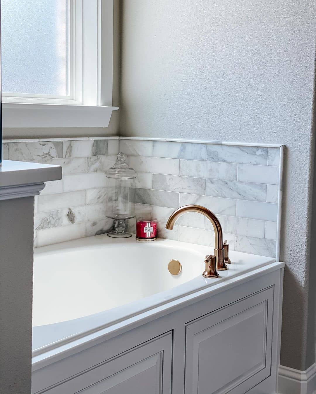 White Drop-in Tub With Marble Subway Tile Surround - Soul & Lane