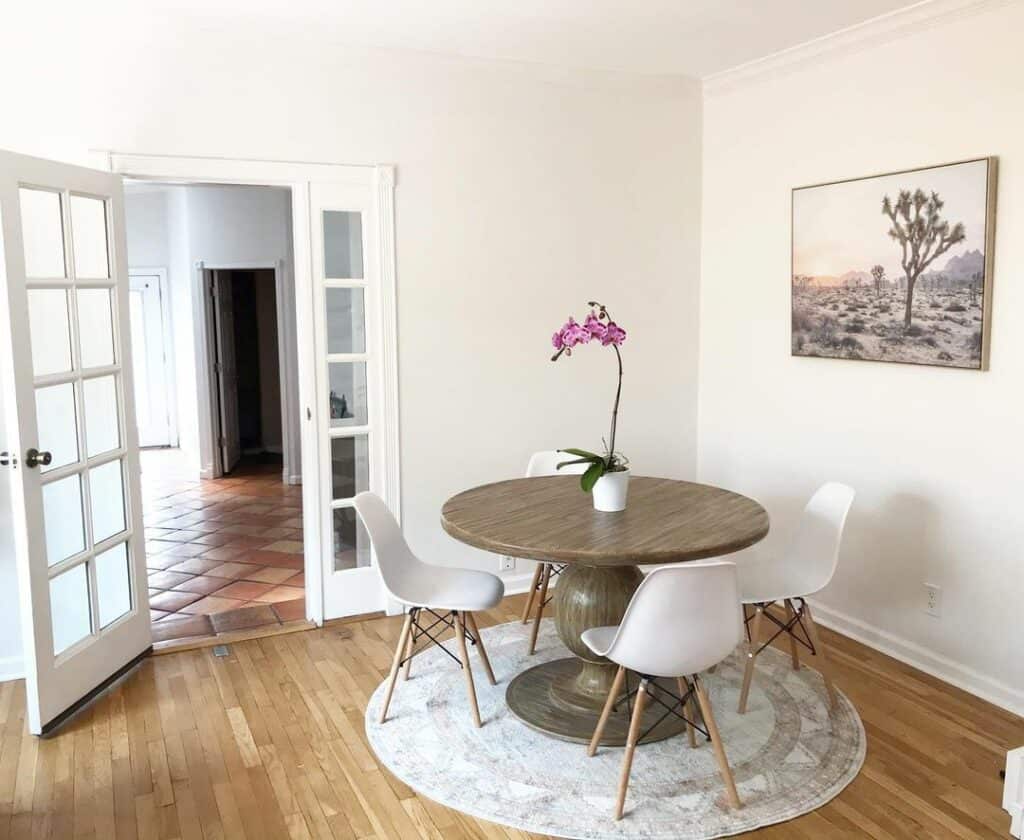 White Minimalist Dining Room With Framed Painting - Soul & Lane